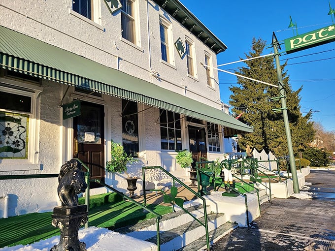 Pat's Steakhouse (front view): "Classic white building with green trim&mdash;Louisville's version of meat Mecca. Even the stairs look excited to welcome you."