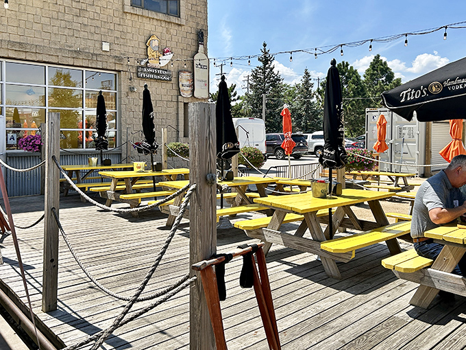 Twisted Fisherman deck: Nautical ropes and sunshine yellow tables? It's like Jimmy Buffett designed a crab shack&mdash;and we're here for it!