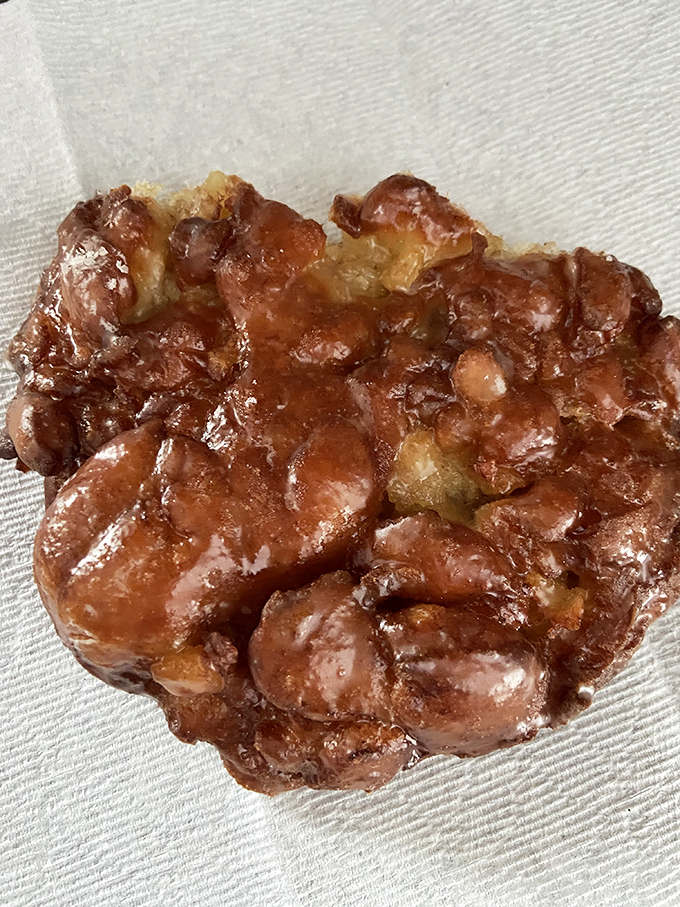 Behold the holy grail of apple fritters&mdash;crispy exterior giving way to tender, apple-studded interior. Worth every sticky finger.