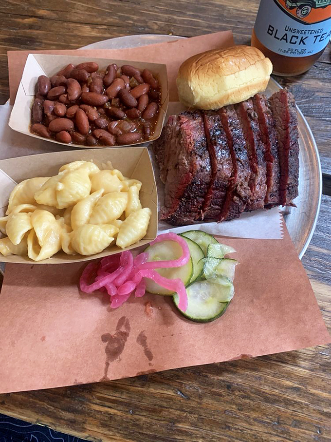 Brisket, beans, and mac & cheese: the holy trinity of comfort that makes you want to hug the pitmaster.