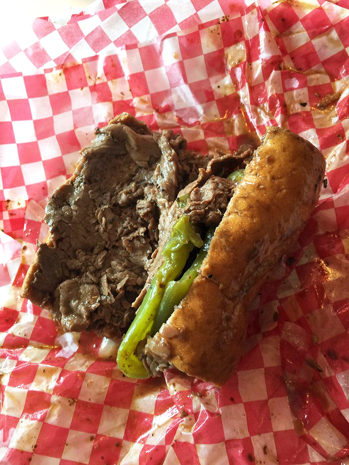 This isn't just a sandwich; it's architecture. Layers of thinly sliced beef with a foundation of bread sturdy enough for the challenge.