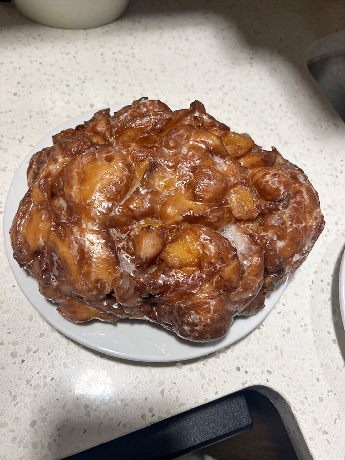 When donuts achieve this level of glazed perfection, they deserve their own white napkin throne. The apple fritter reigns supreme among worthy contenders.