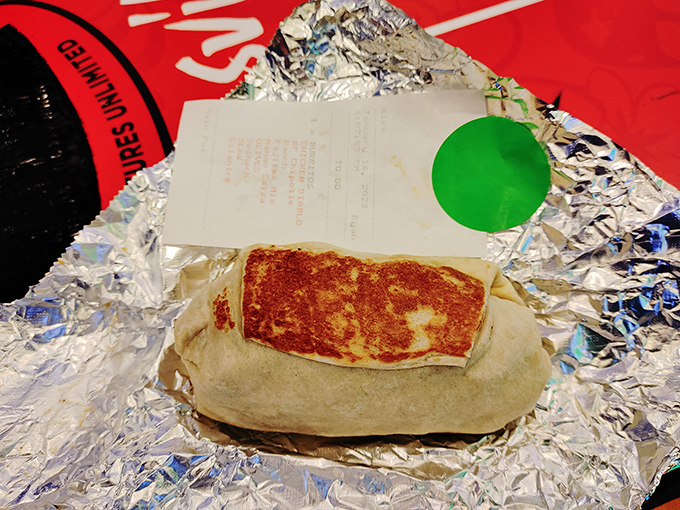 Even wrapped to go, this burrito maintains its dignity and structural integrity&mdash;the Fort Knox of portable meals, guarding its treasures until you're ready.