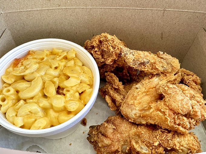 Mac and cheese so creamy it should have its own fan club, paired with chicken that makes Colonel Sanders look like an amateur.