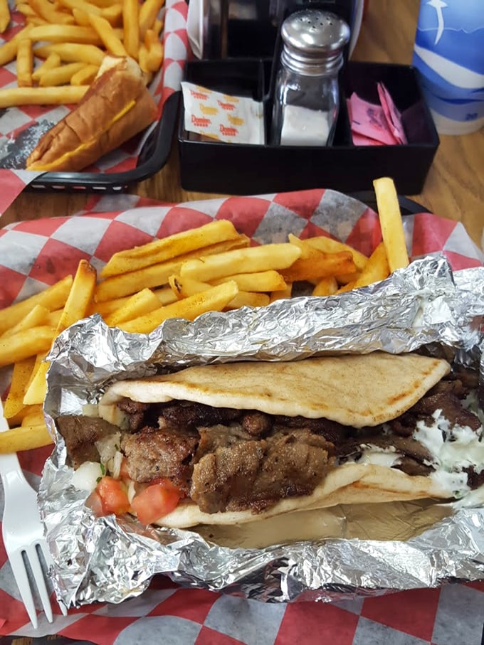 Golden fries flanking a hero-sized gyro&mdash;the kind of meal that makes you temporarily forget your manners and table etiquette.