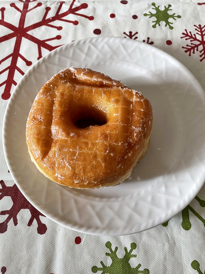 One perfect Spudnut on a holiday plate&mdash;proof that sometimes the simplest pleasures make the most memorable gifts.