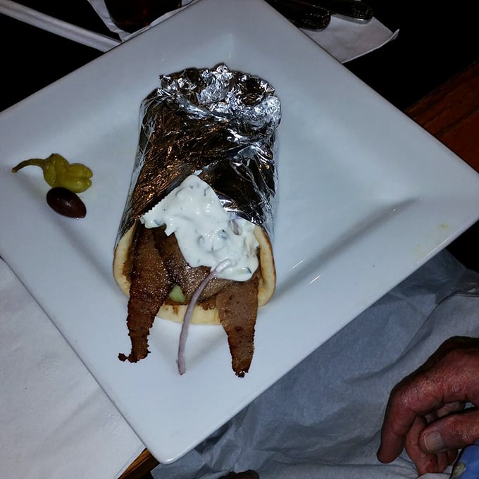 Lamb so tender it practically whispers ancient Greek poetry while the tzatziki provides cool, creamy contrast.