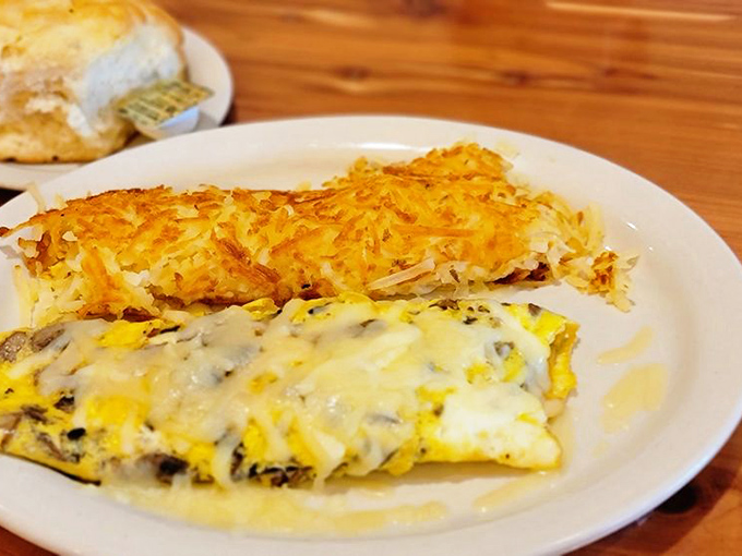This isn't just an omelette&mdash;it's a cheese-draped masterpiece with hash browns so perfectly golden they deserve their own trophy.