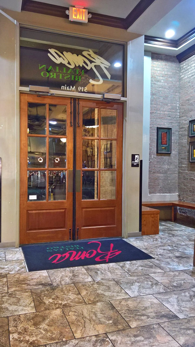 Roma Italian Bistro's wooden doors promise the kind of authentic Italian experience that makes you forget you're in Louisiana &ndash; until your server says "y'all."