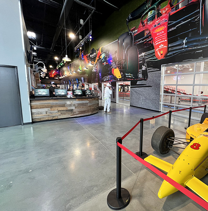 The reception area showcases racing memorabilia that reminds you this isn't just play&mdash;it's a proper motorsport with history and heroes.