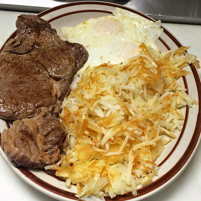 Mushrooms and steak, a marriage so perfect it deserves its own reality show. That baked potato wrapped in foil is the silent hero.