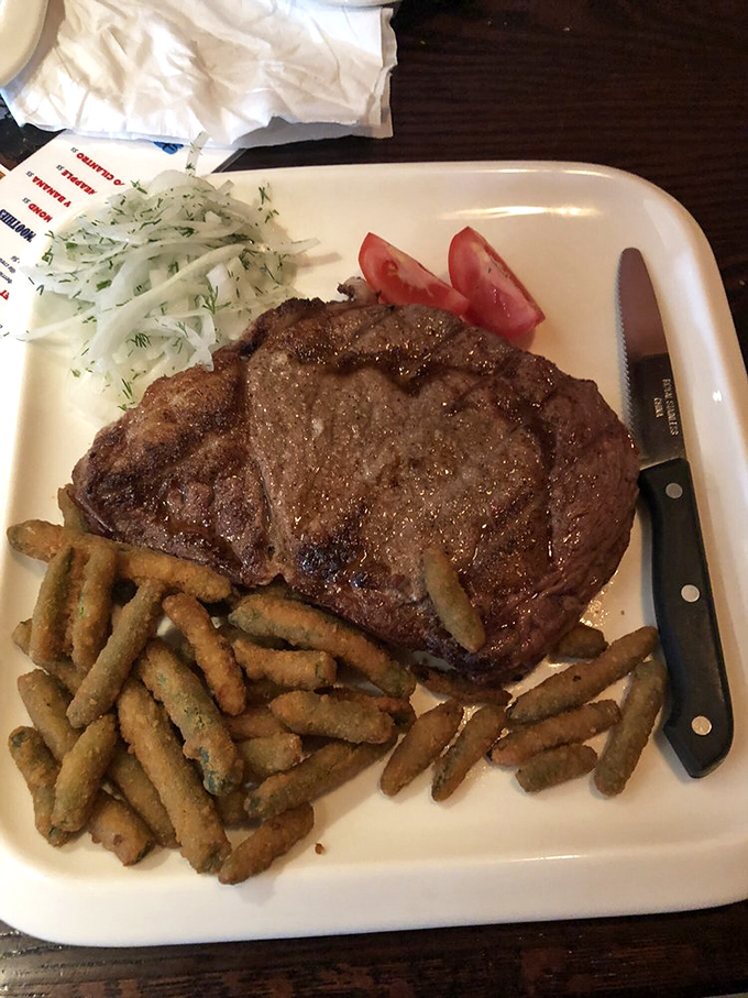 A T-bone that deserves its own ZIP code, paired with mashed potatoes so fluffy they could double as pillows on a luxury airline.