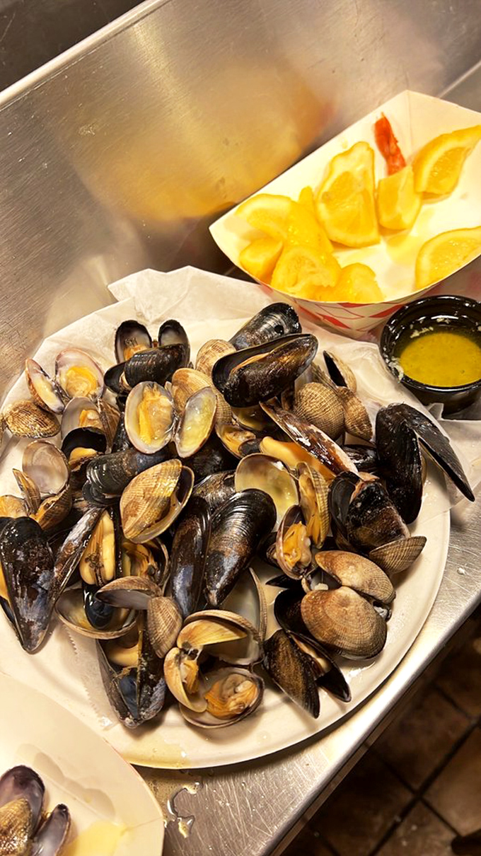 A shellfish symphony in a simple paper dish. These mussels and clams have only one request: bring your appetite and leave your dignity.
