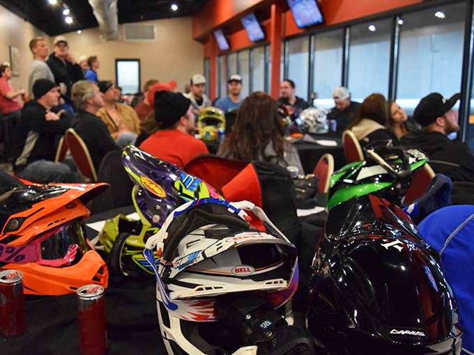 The pre-race briefing area&mdash;where helmets gather like exotic fruits and everyone pretends they're just there "for fun," not to dominate.