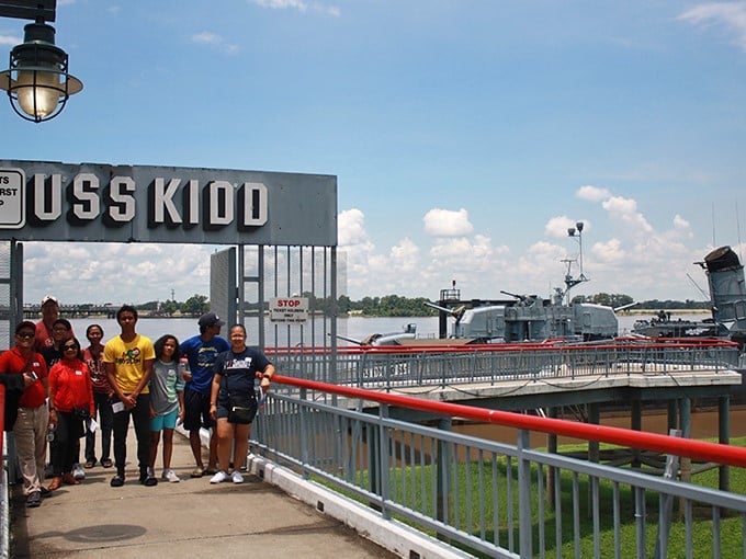 History floats on the Mississippi at the USS Kidd memorial, where visitors pause to connect with America's naval heritage.