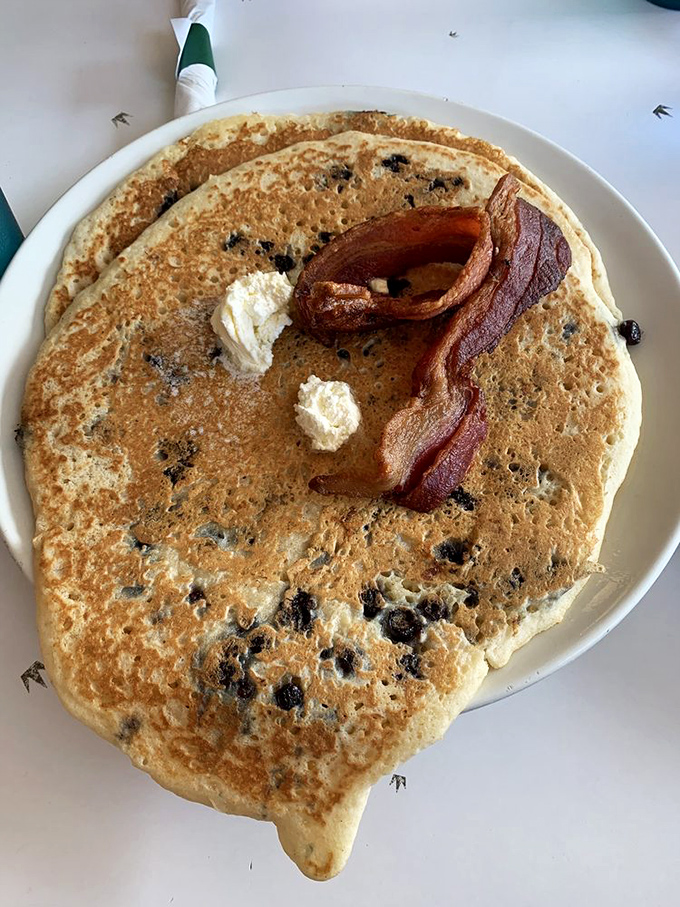 Behold the pancake that ate Manhattan&mdash;a blueberry-studded frisbee of joy topped with nature's candy and a bacon exclamation point.