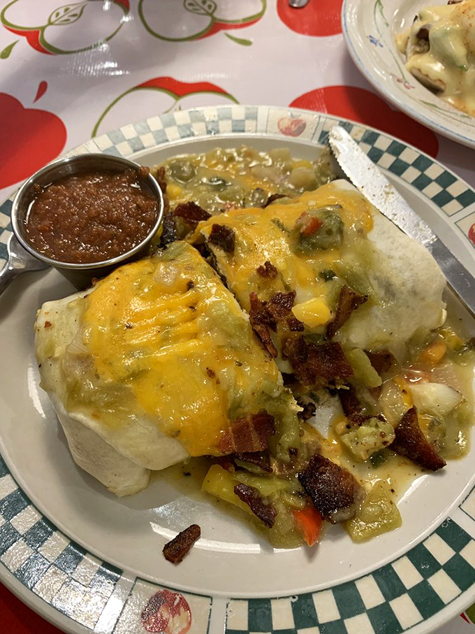 A tortilla-wrapped masterpiece smothered in green chile sauce. The kind of breakfast that makes you want to high-five strangers.