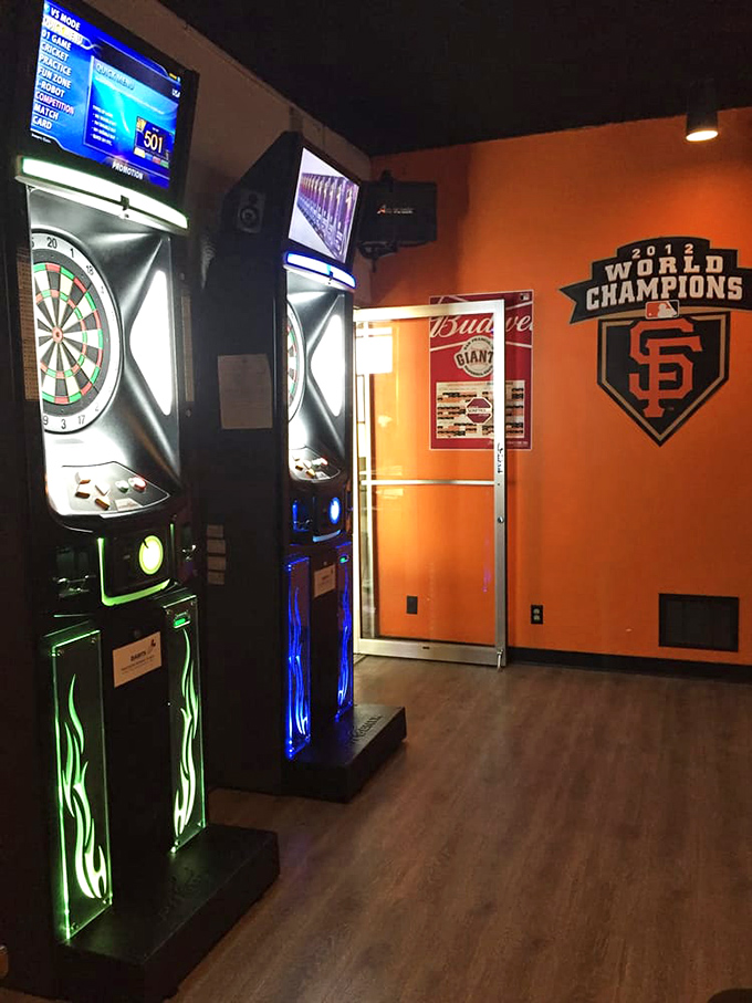 Between frames, electronic darts offer a change of pace. Notice the Giants banner&mdash;this is definitely Bay Area territory!