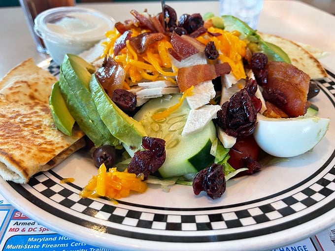 A salad that doesn't apologize for being delicious. Avocado, cheese, cranberries, and chicken prove healthy eating doesn't have to be punishment.