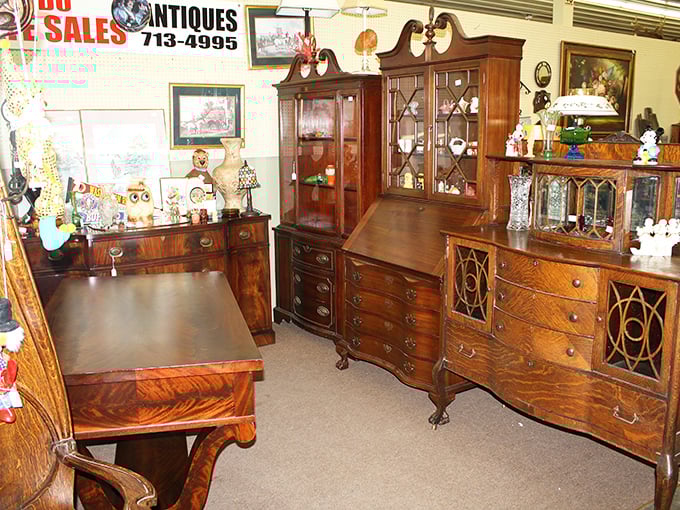 Pull up a chair to history! This display of pristine wooden furniture invites you to imagine the conversations that happened around these tables decades ago.