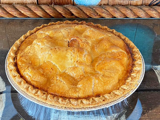 This golden-domed apple pie isn't just dessert&mdash;it's American heritage on a plate. The glistening crust practically whispers "resistance is futile."