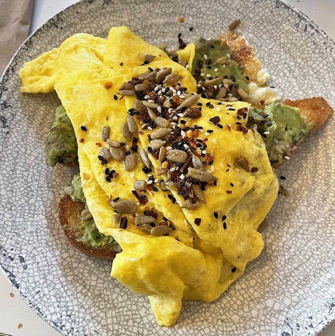 This isn't just avocado toast&mdash;it's breakfast architecture, where eggs, seeds, and greens create a morning masterpiece that Instagram was invented for.