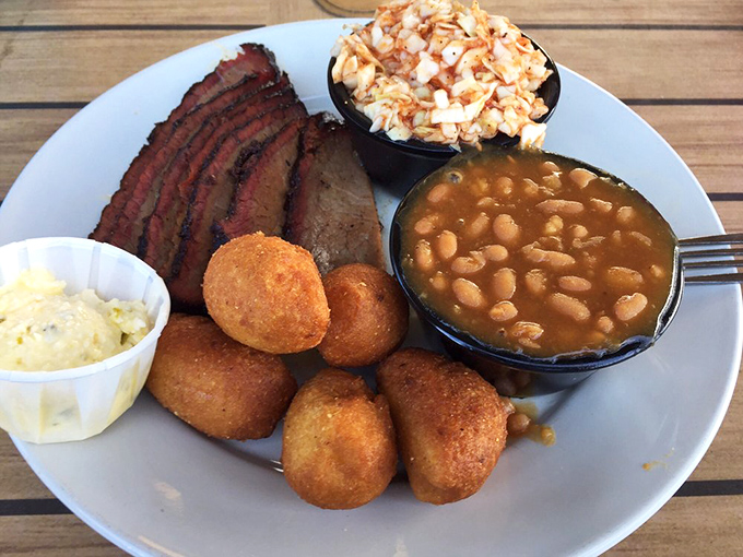 Barbecue plated with the confidence of knowing you'll be back. That smoke ring is like nature's way of saying "you chose wisely."