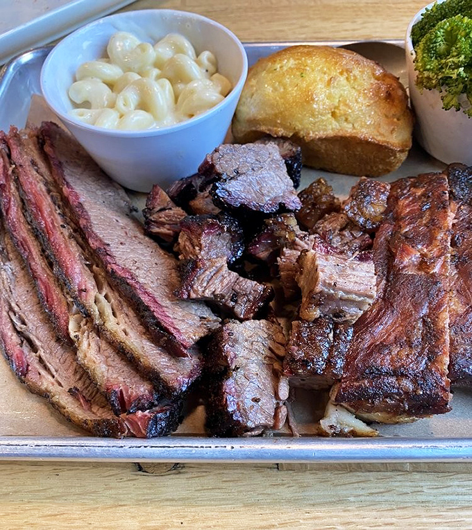 Not so much a meal as a carnivorous carnival&mdash;brisket, ribs, and pulled pork sharing a metal tray like the Mount Rushmore of smoked proteins.