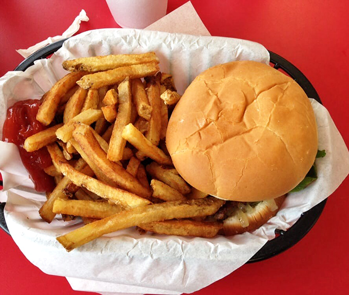 The holy trinity of American cuisine: golden fries, a perfectly toasted bun, and a burger that makes you question all your previous life choices.