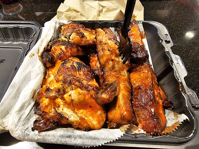 Chap's barbecue chicken wears its char marks like medals of honor, glistening with sauce that demands to be licked from your fingers.