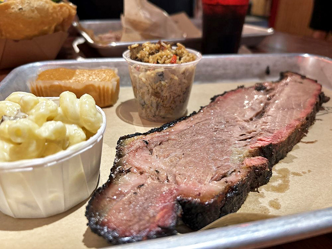 Brisket so tender it practically surrenders to your fork. The mac and cheese alongside is having its own little party.