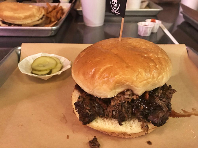 The brisket sandwich arrives like a meaty monument to patience, each slice bearing witness to hours of low-and-slow dedication.