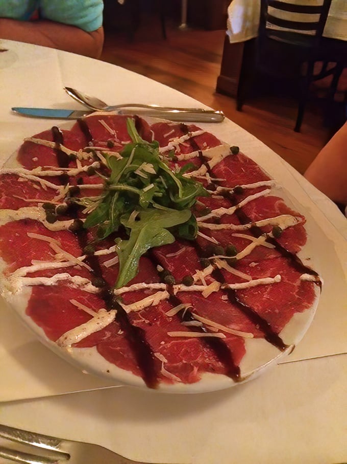 Carpaccio so delicate it practically blushes when you look at it. Those capers are playing hide-and-seek with your taste buds.