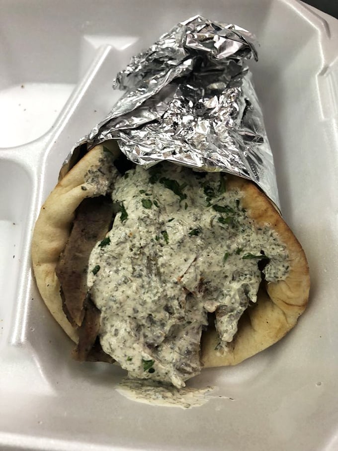 Behold the gyro in its natural habitat &ndash; juicy, savory meat nestled in a pillowy bun with melted cheese. This is what sandwich dreams are made of.