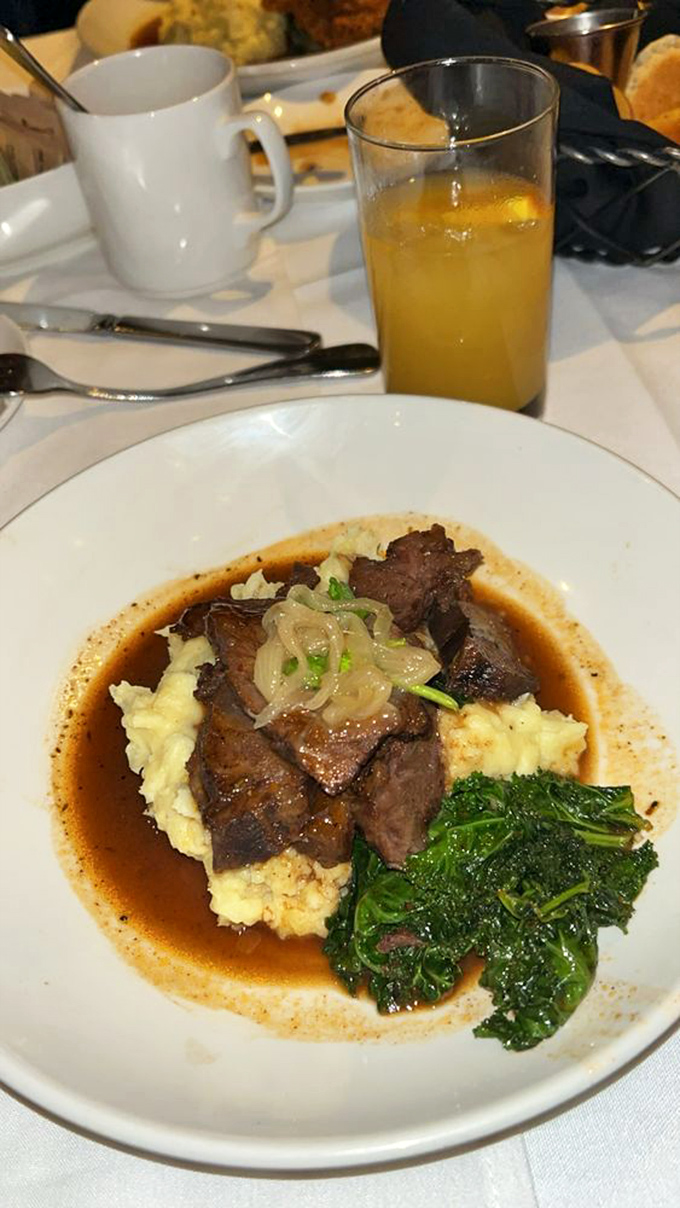 Tender beef cheeks resting on a cloud of mashed potatoes&mdash;like a culinary trust fall that works spectacularly well.