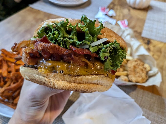 Behold the bacon cheeseburger that launched a thousand road trips. That perfect ratio of meat to toppings is what burger dreams are made of.