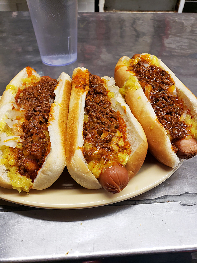 The holy trinity of diner perfection: chili dogs, a bowl of beans, and an ice-cold milk. Comfort food doesn't need a fancy pedigree.