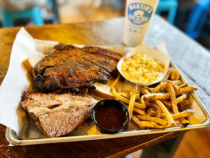 The Big Brother Sampler &ndash; where ribs and brisket coexist in harmony on a metal tray that's seen more joy than a therapist's couch.