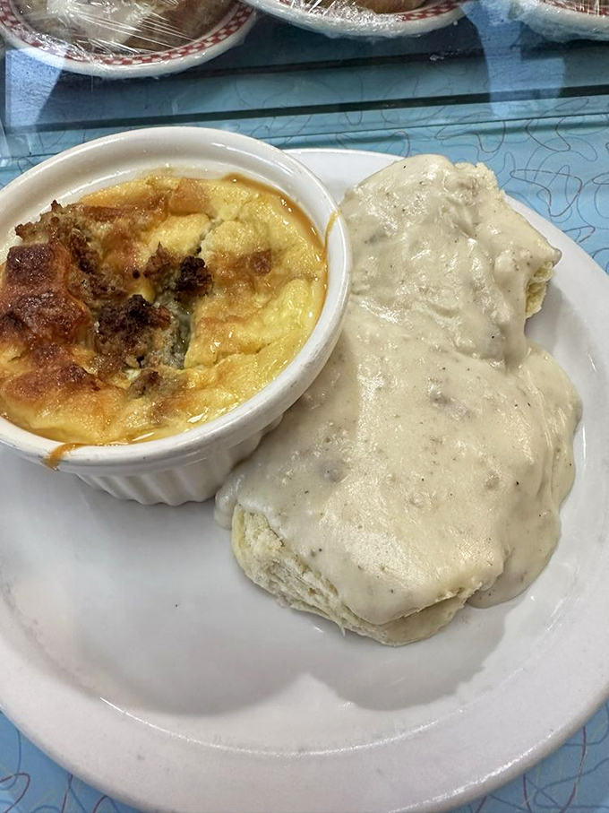 Biscuits smothered in creamy gravy with enough black pepper to remind you that comfort food should still have a backbone.