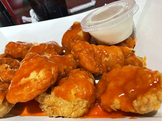 Buffalo wings so saucy they should come with their own rain poncho. That cooling ranch dip isn't optional&mdash;it's essential crisis management.