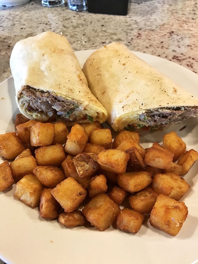 Breakfast carnitas and home fries: the dynamic duo of morning satisfaction. Those perfectly cubed potatoes deserve their own fan club and merchandise line.