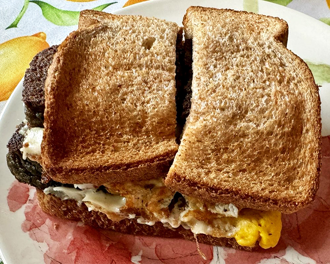 Breakfast between toast: where farm-fresh eggs and melty cheese create the kind of morning motivation no alarm clock could ever provide.