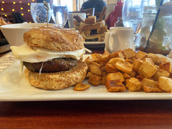 Behold the breakfast sandwich that makes you question why you ever settled for drive-thru versions. That biscuit looks like it could float away on buttery clouds.