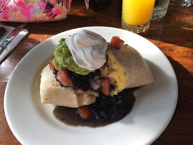 Breakfast burritos should always look this good&mdash;stuffed to bursting with black beans and topped with cool avocado and sour cream, it's vacation wrapped in a tortilla.