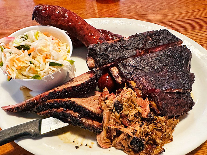 This isn't just dinner; it's edible architecture&mdash;layers of bark-crusted brisket and tender pulled pork creating a monument to patience and fire. 