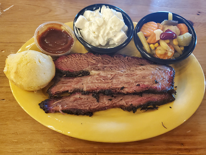 Brisket that's been kissed by smoke for hours, served with sides that know their supporting role but still manage to shine.