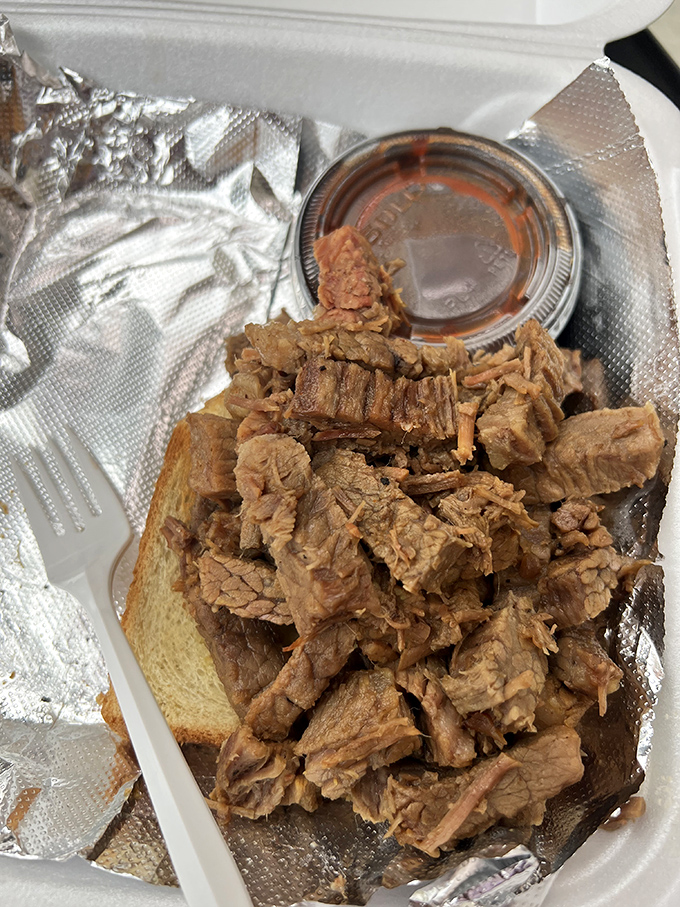 A sandwich that requires both hands and your undivided attention. This brisket didn't spend hours in the smoker just to be rushed through.