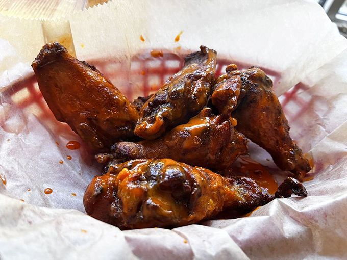 These wings aren't just cooked&mdash;they're transformed. Glistening with sauce and waiting to turn your fingers into sticky evidence of good decisions.