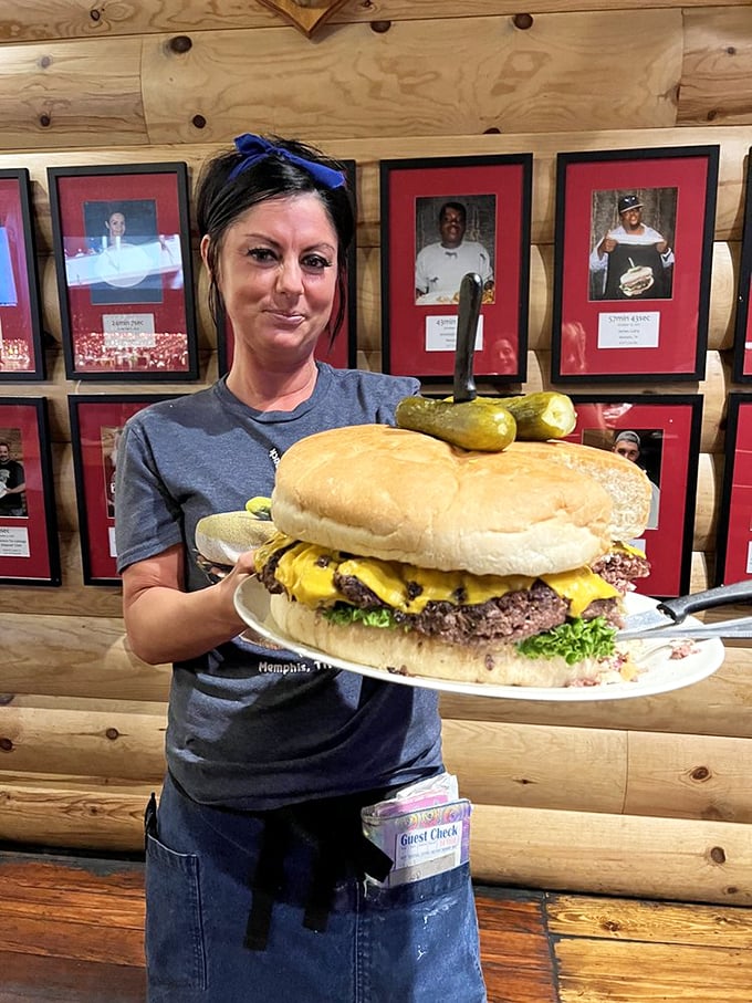 Behind every successful burger challenge winner is a wall of fame that says, "These brave souls came, they saw, they conquered four pounds of beef."
