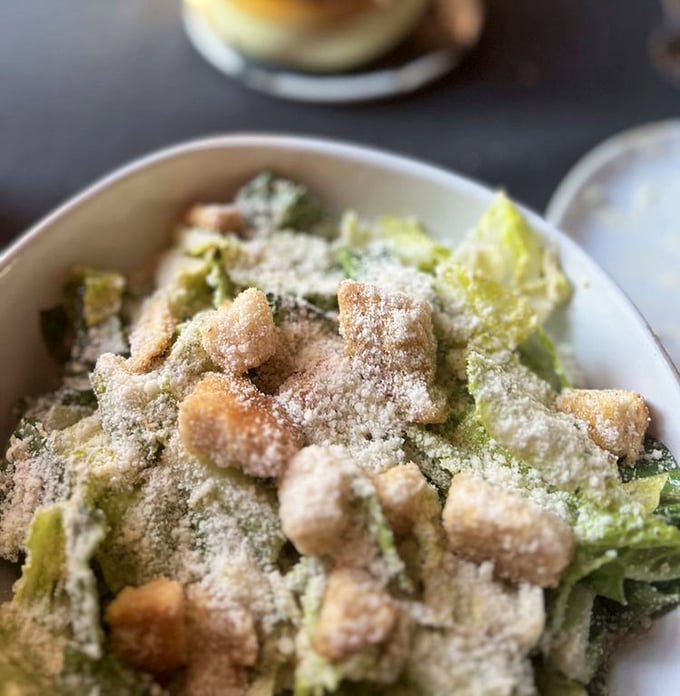 A proper Caesar salad that Julius himself would approve of&mdash;crisp romaine, generous parmesan, and croutons that crunch like they mean it.